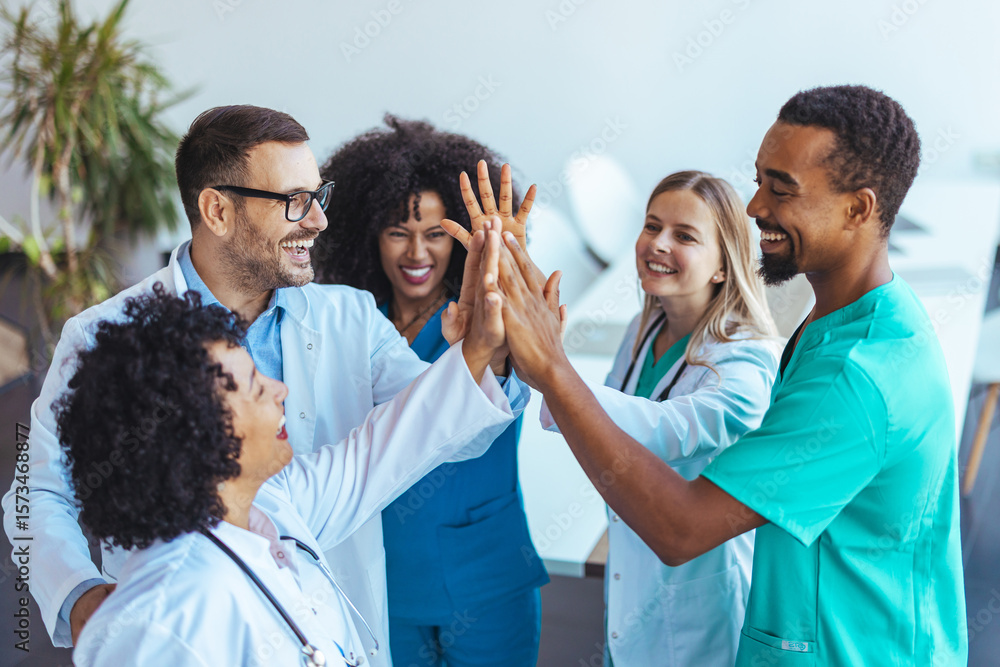 Group of Medical Professionals Celebrating Success With a Team High ...