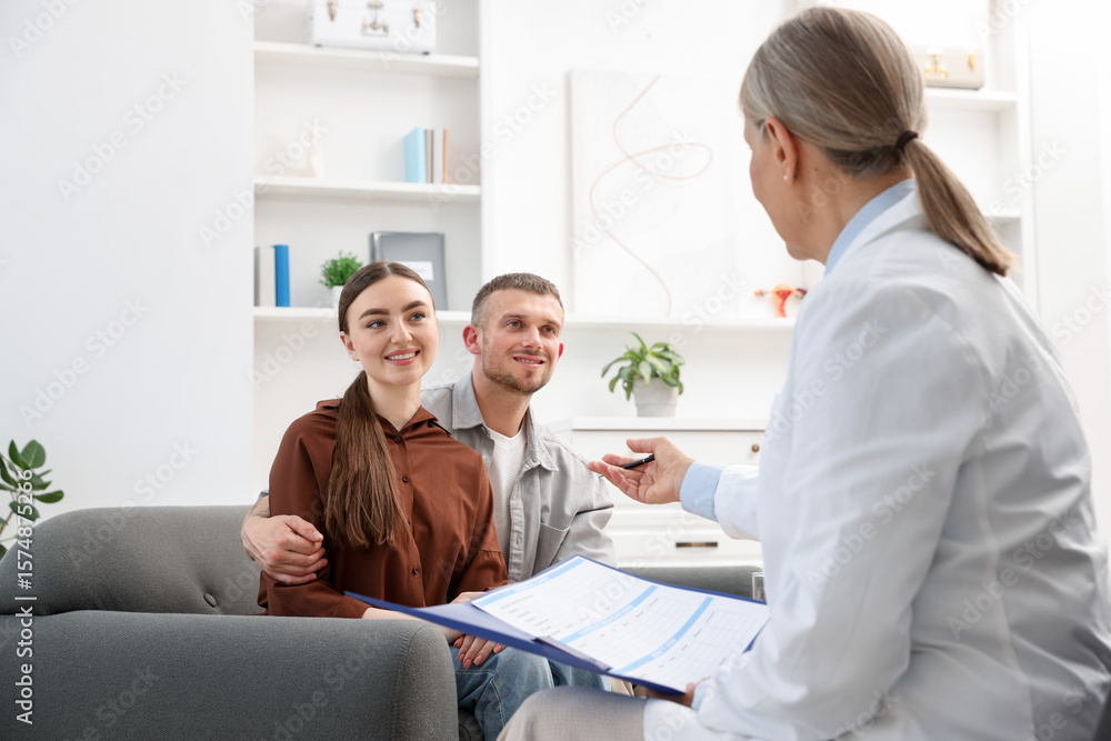 In vitro fertilization (IVF). Couple having consultation with doctor in ...