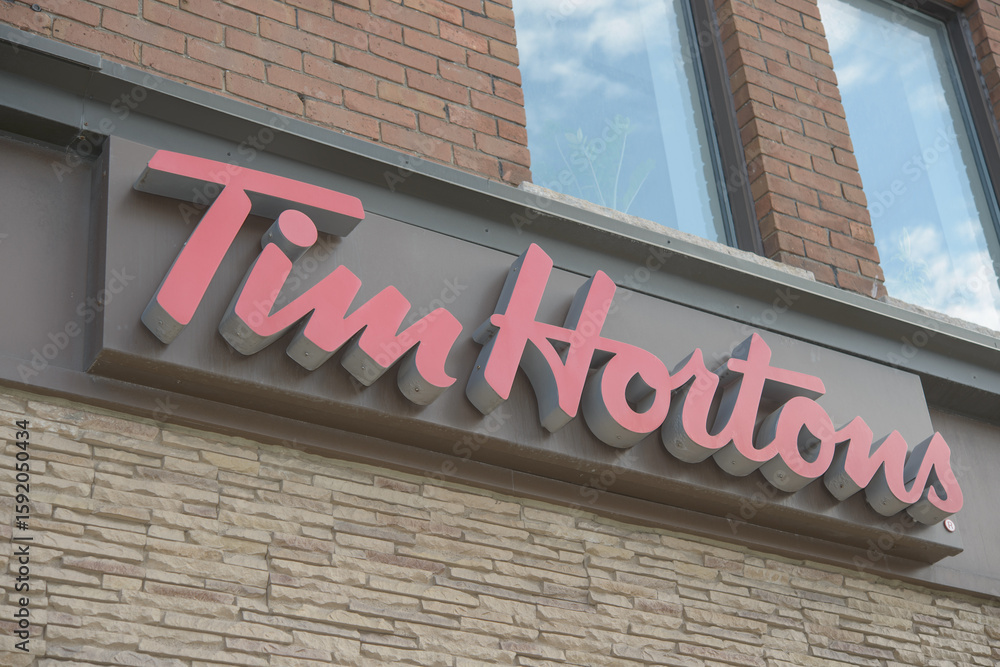 storefront sign outside Tim Hortons, a coffee shop chain, located here ...