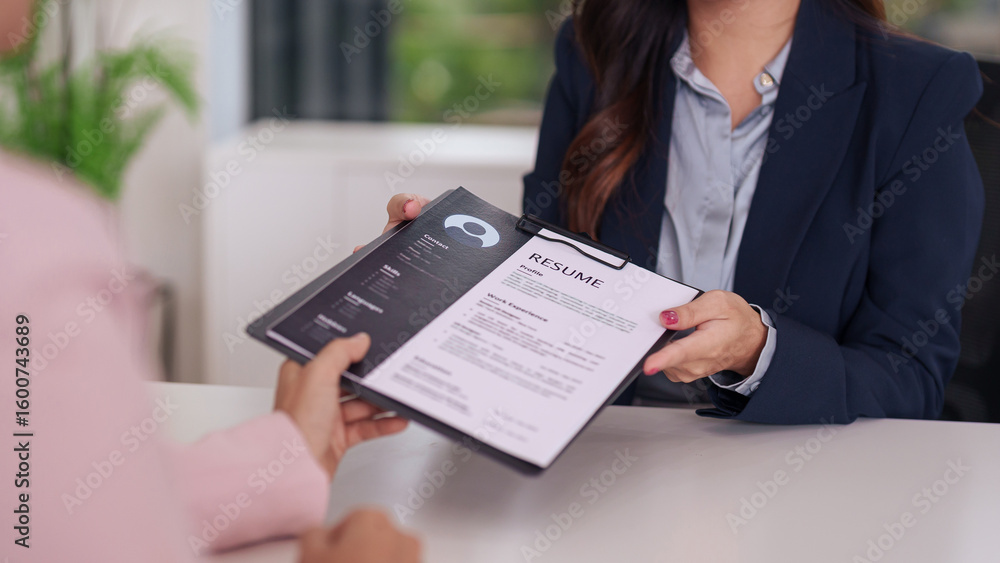 Professional adult Asian woman recruiter receives job application ...