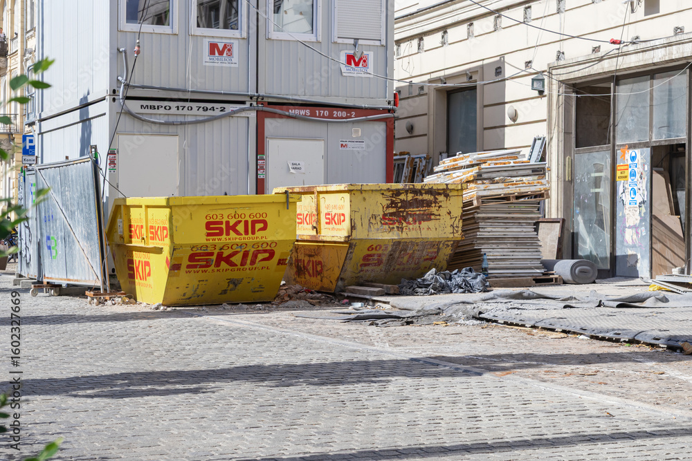 Foto de Stock Poznan, Poland - July 16, 2025: SKIP Group yellow ...