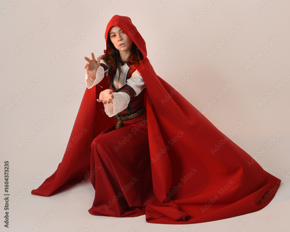 full length portrait pretty young female brunette model wearing a red ...