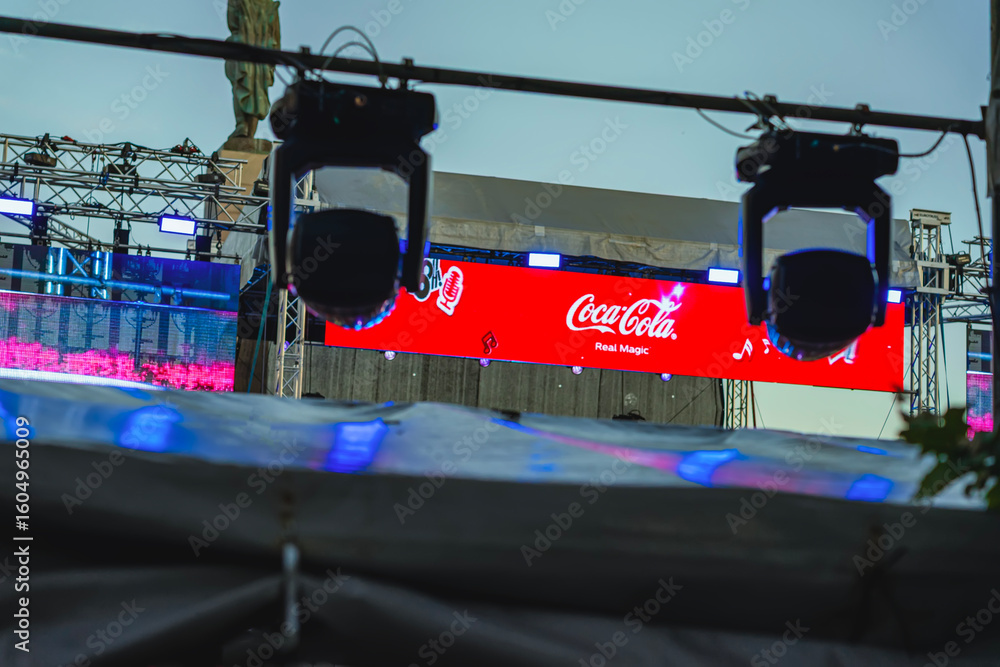 Coca-Cola Real Magic logo displayed on red LED screen above concert ...