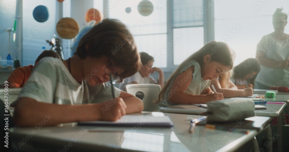 Elementary School Students Writing Exam or Doing Tasks in Notebooks ...