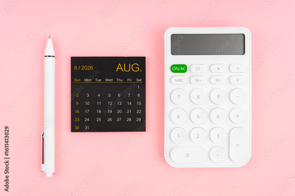 ภาพถ่าย Stock August 2026 calendar and white calculator with pen on ...