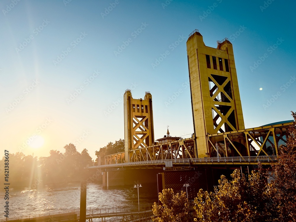 golden Tower Bridge over the Sacramento River. The bridge is the ...