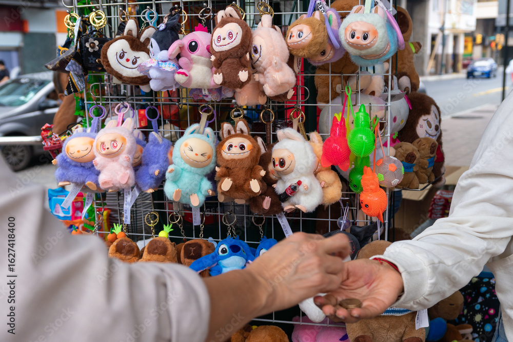 Guayaquil, Ecuador – July 27th, 2025: Street sale of keychains and ...