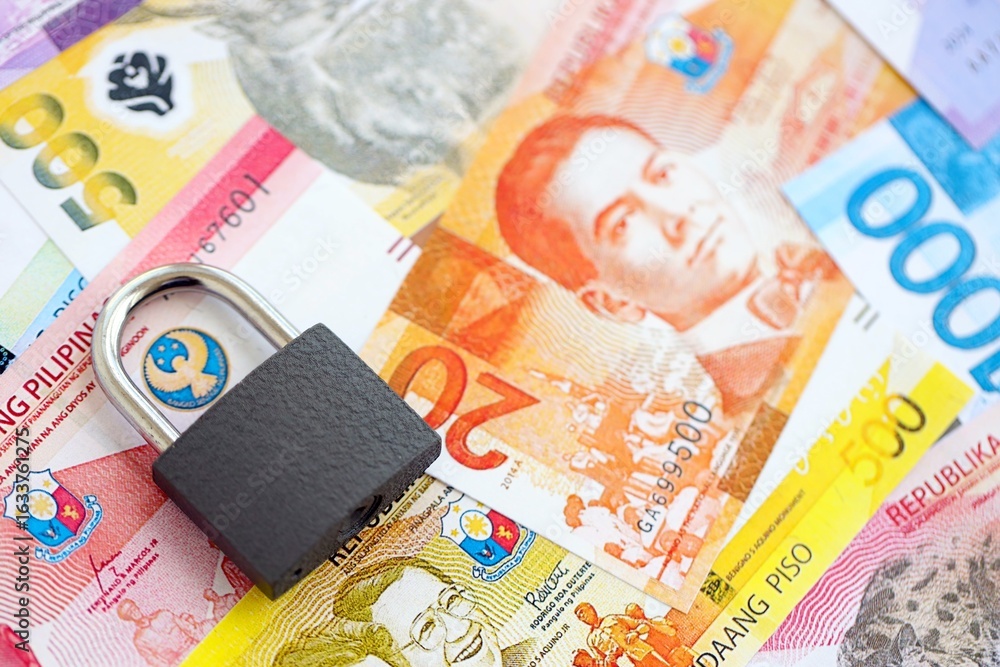 Foto de Stock Philippines peso currency money bills and padlock. The ...
