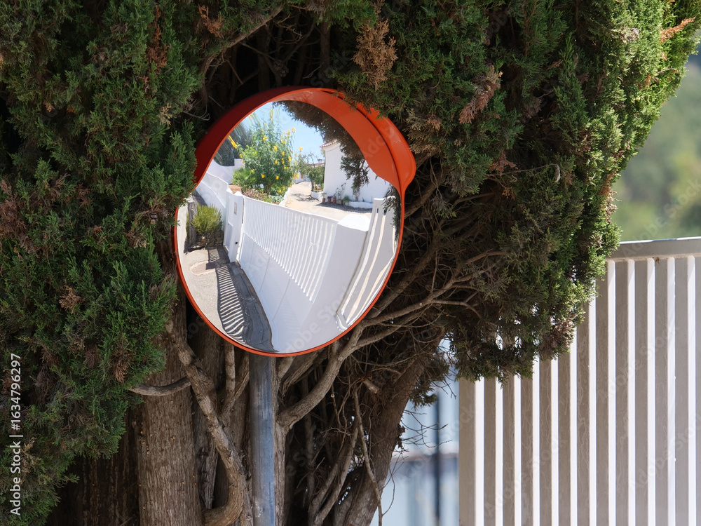 Traffic mirror, often used at blind intersections or exits to improve ...