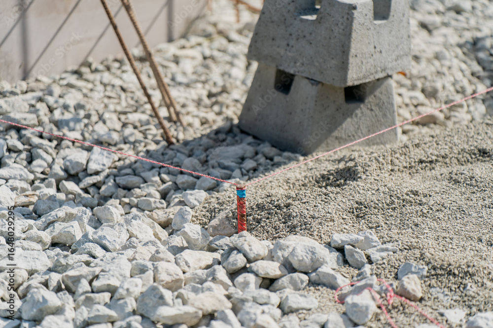 Construction site alignment with string line and concrete blocks for ...