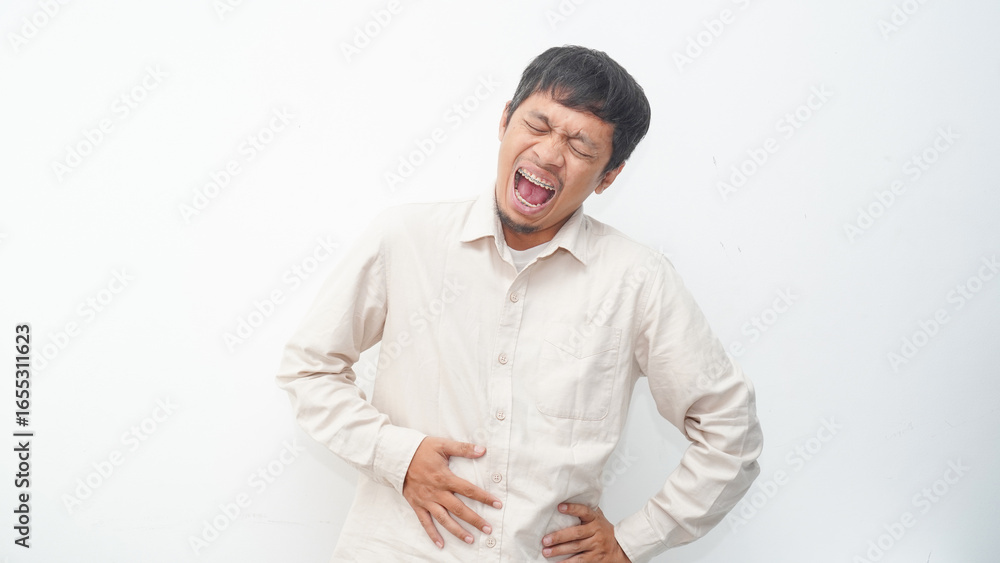 Positive and joyful Asian male into laughing holding his hands on ...
