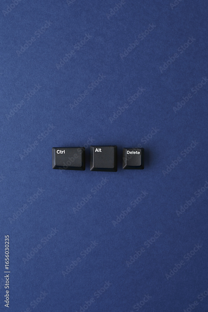 Ctrl alt and delete keys on a blue background. Stock Photo | Adobe Stock