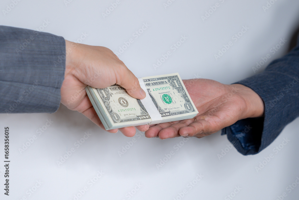 Close-up symbolic shot of corruption and bribery, showing hidden hand ...