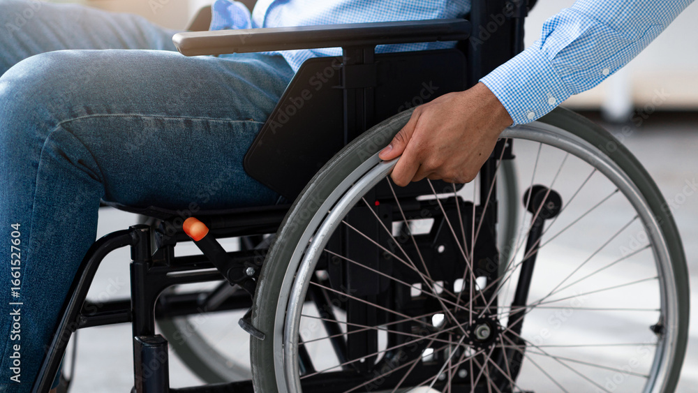 Cropped view of with disability black man sitting in wheelchair at home ...