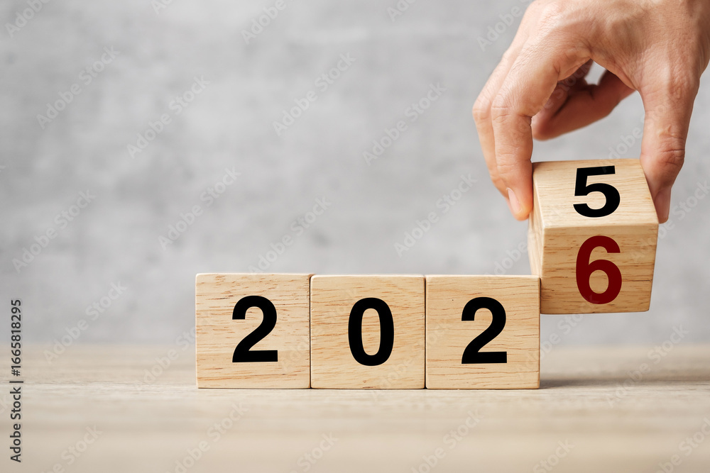 hand flipping block 2025 to 2026 text on table. Resolution, strategy ...