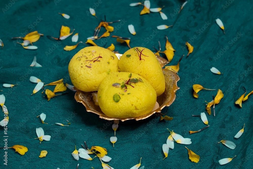 Raj bhog an indian sweet dish dipped in sugar syrup garnished with dry ...