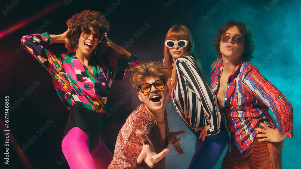 Glam retro group expressing charisma with colorful disco outfits ...