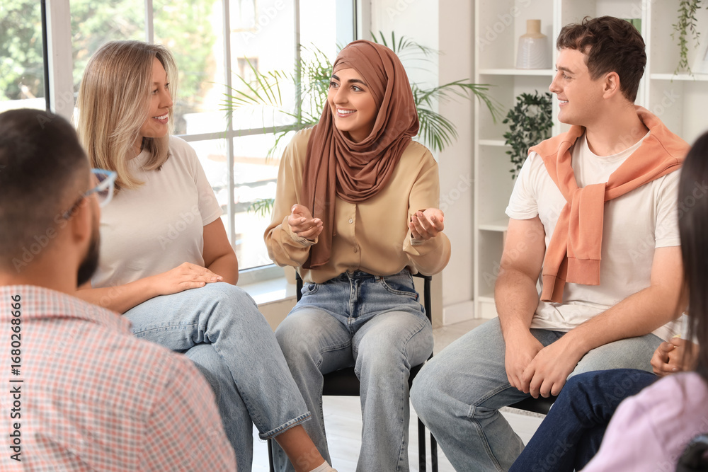 Young Muslim woman talking at group therapy session Stock Photo | Adobe ...