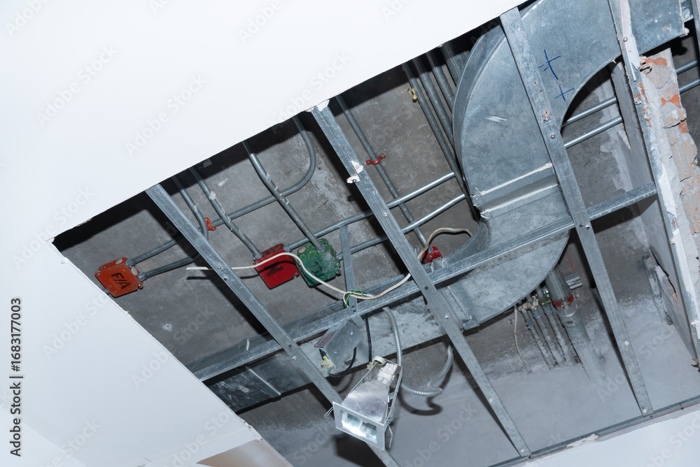 Ceiling under construction, revealing the metal frame for a suspended ...