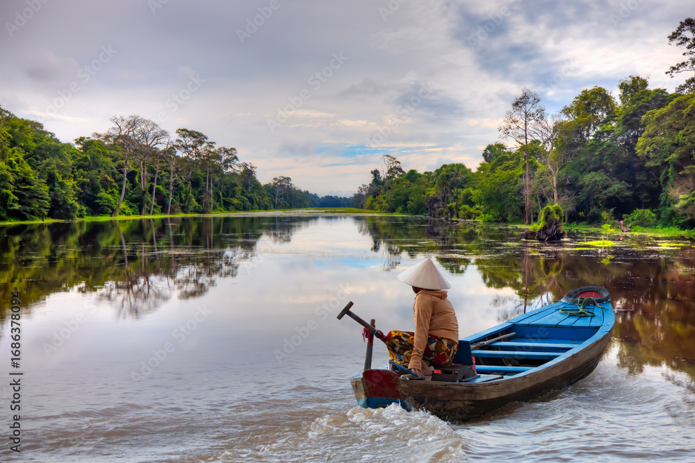 Fisherman in his boat, Floating village of Angkor Wat traditional river ...