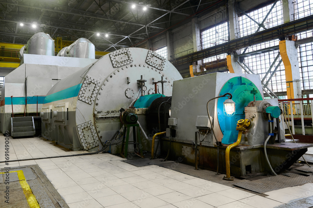 Powerful industrial steam turbine generator set located in thermal ...