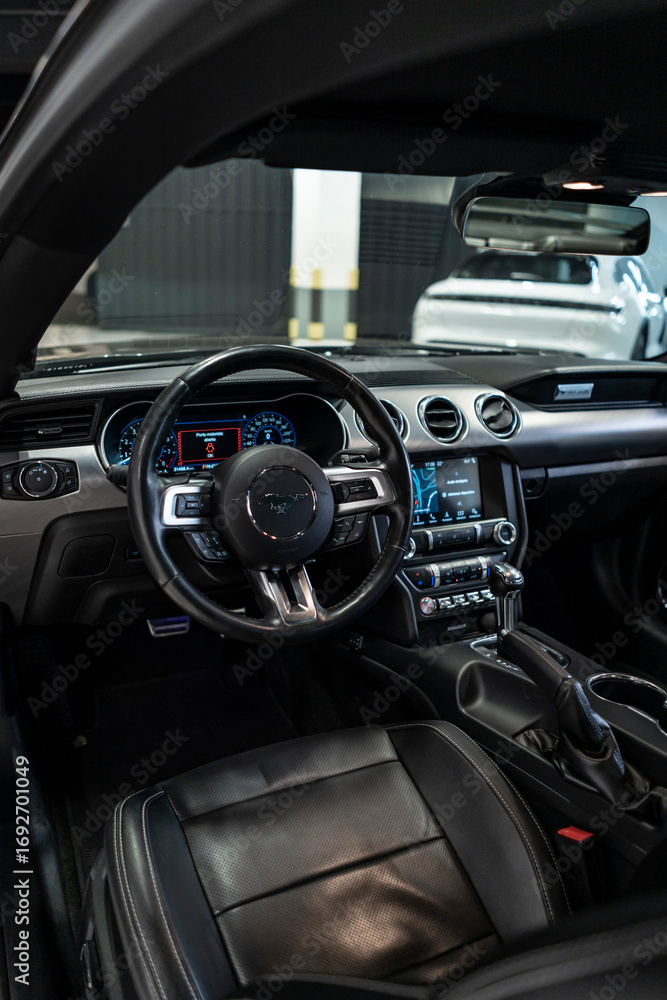 Cockpit of a Ford Mustang with blue ambient lighting, Interior of a ...