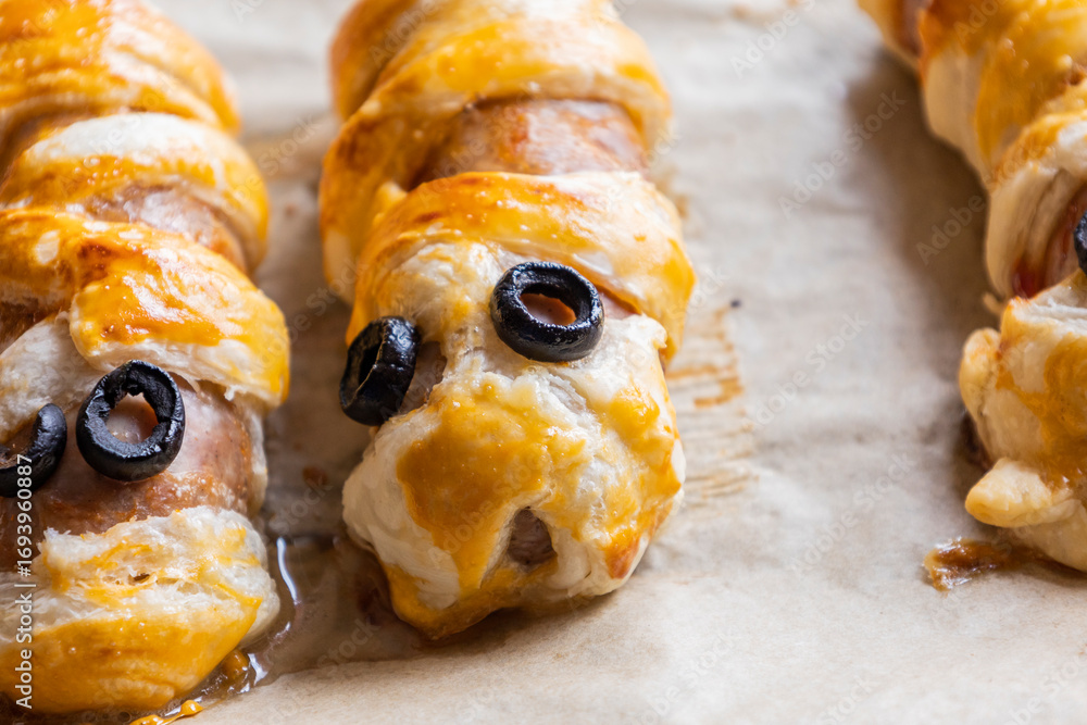freshly baked sausage mummies made with golden puff pastry and small ...