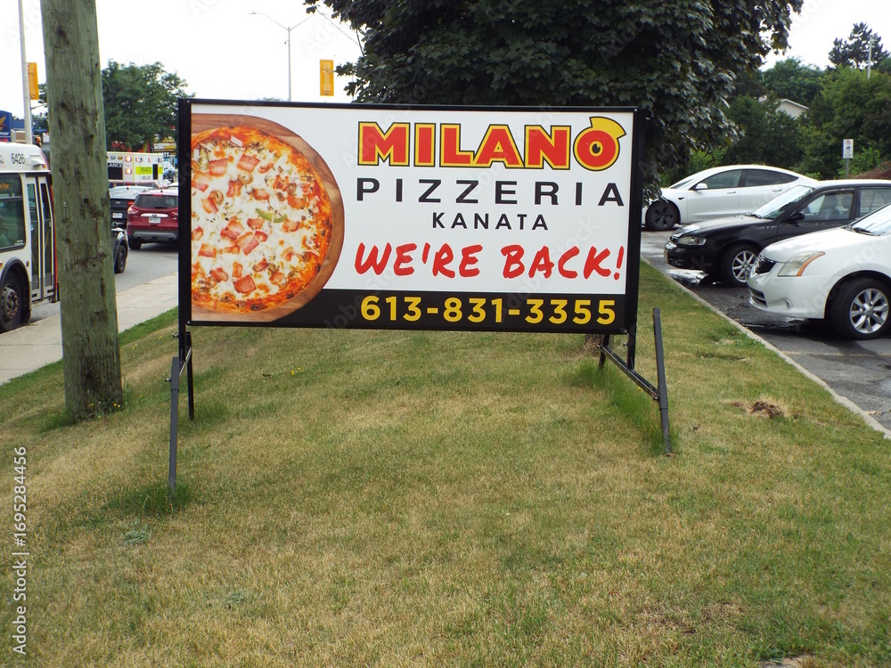 Kanata, ON, Canada, June 17, 2025: A large, temporary sign for "Milano ...