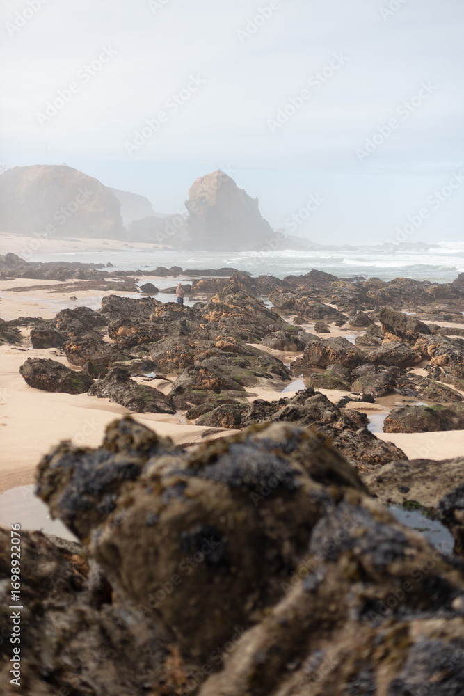 Coastal rocks with view of Santa Cruz town in Torres Vedras, Portugal ...