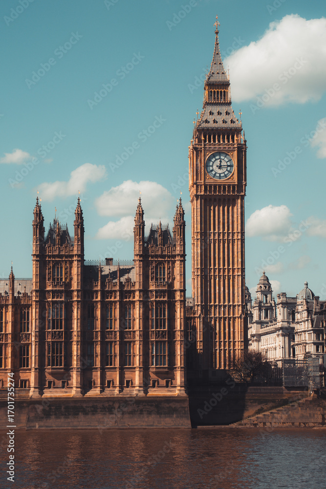 Majestic big ben clock tower against blue sky and white clouds, a ...