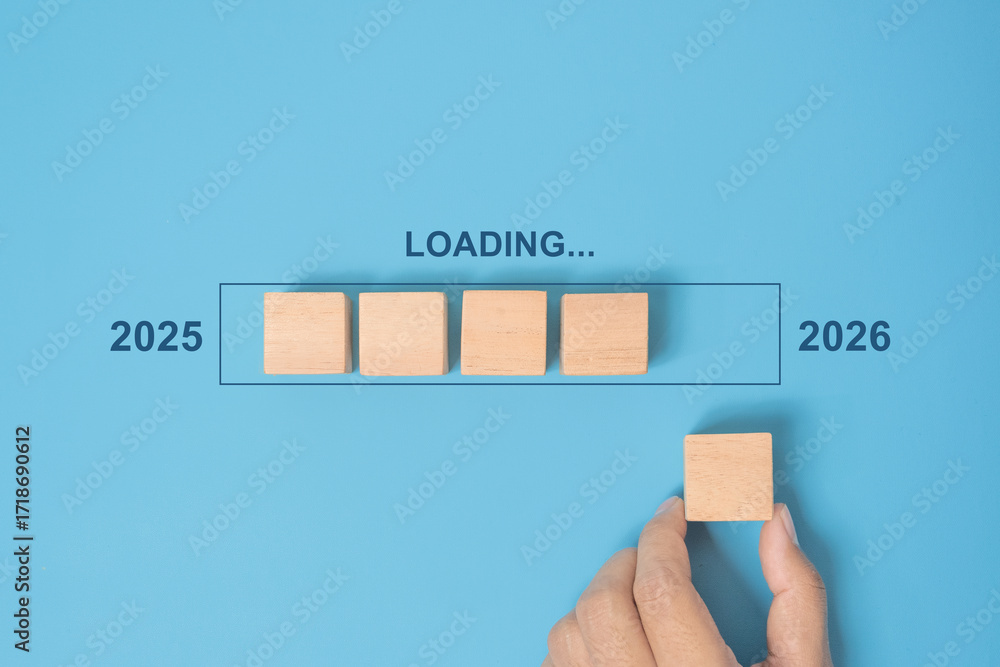 Fotografie Loading Progress Bar from 2025 to 2026 with Wooden Blocks. A ...