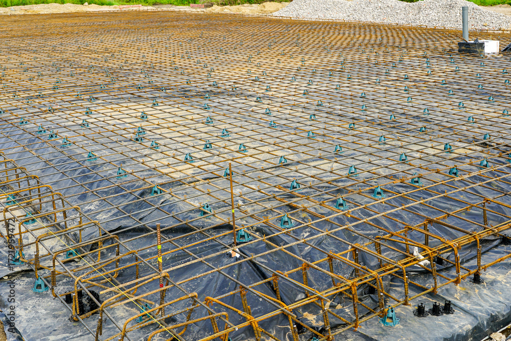 Reinforced steel rebar grid foundation with plastic sheet for concrete ...