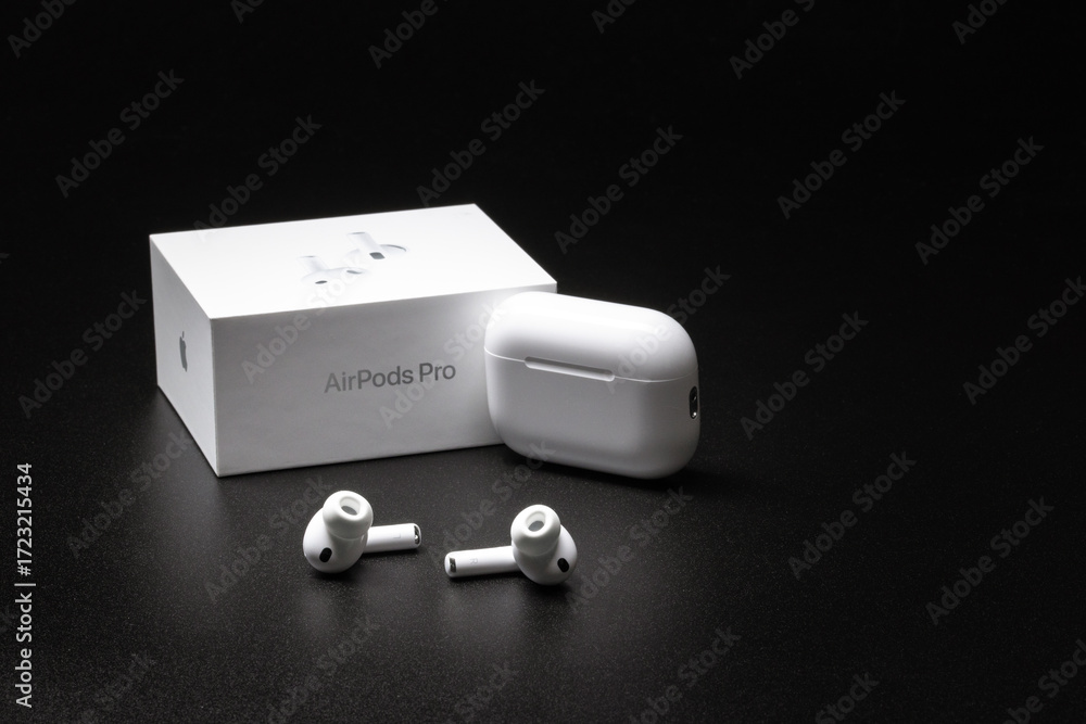 Stock-Foto „Apple AirPods Pro 3 next to packaging box and charging case ...