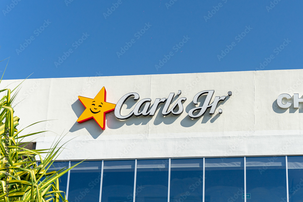 Carl's Jr. fast-food logo on the facade of one of its franchise ...