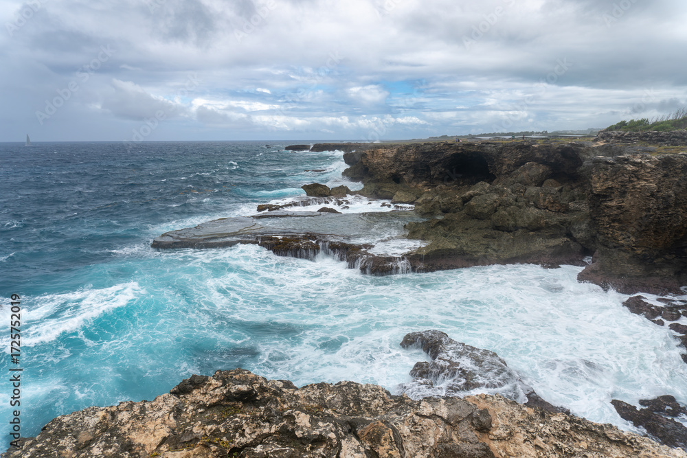 Animal Flower Cave and cliffs at North Point, St. Lucy, Barbados. Cave ...