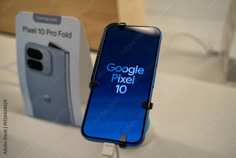 Google Pixel 10 smartphone display with Pixel 10 Pro Fold poster in ...