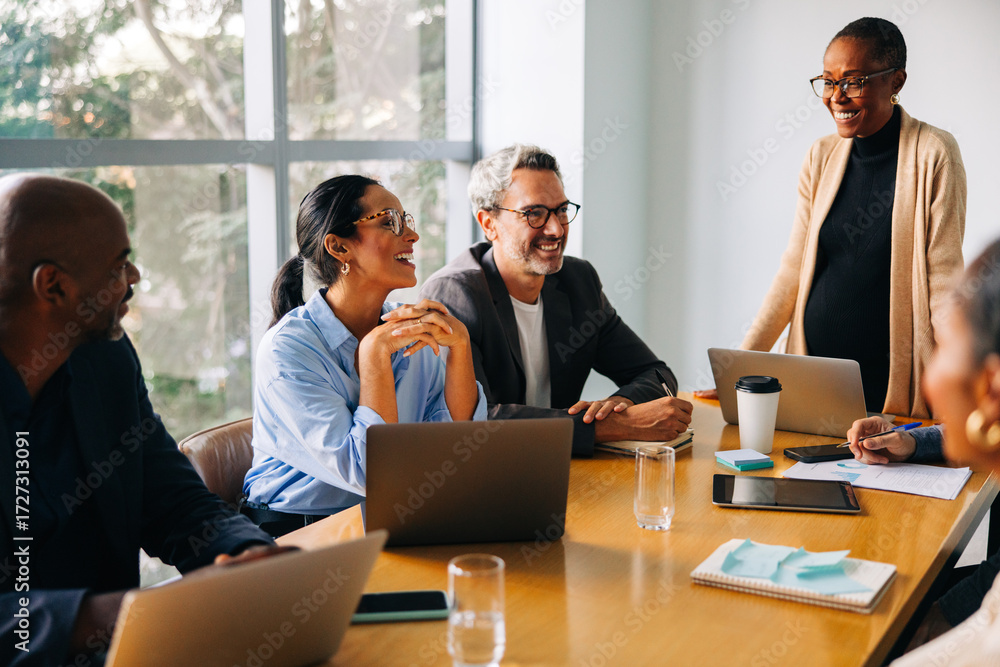 Diverse colleagues gathered around a table during a professional ...