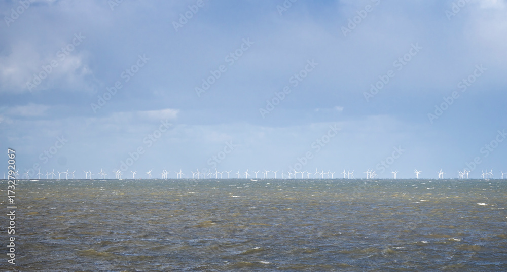 Photo Stock Large number of offshore wind turbines off the coast of ...