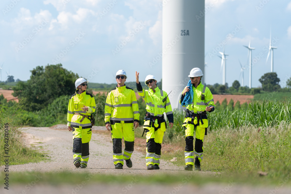 Engineers windmill team wearing uniform and helmet walking survey work ...