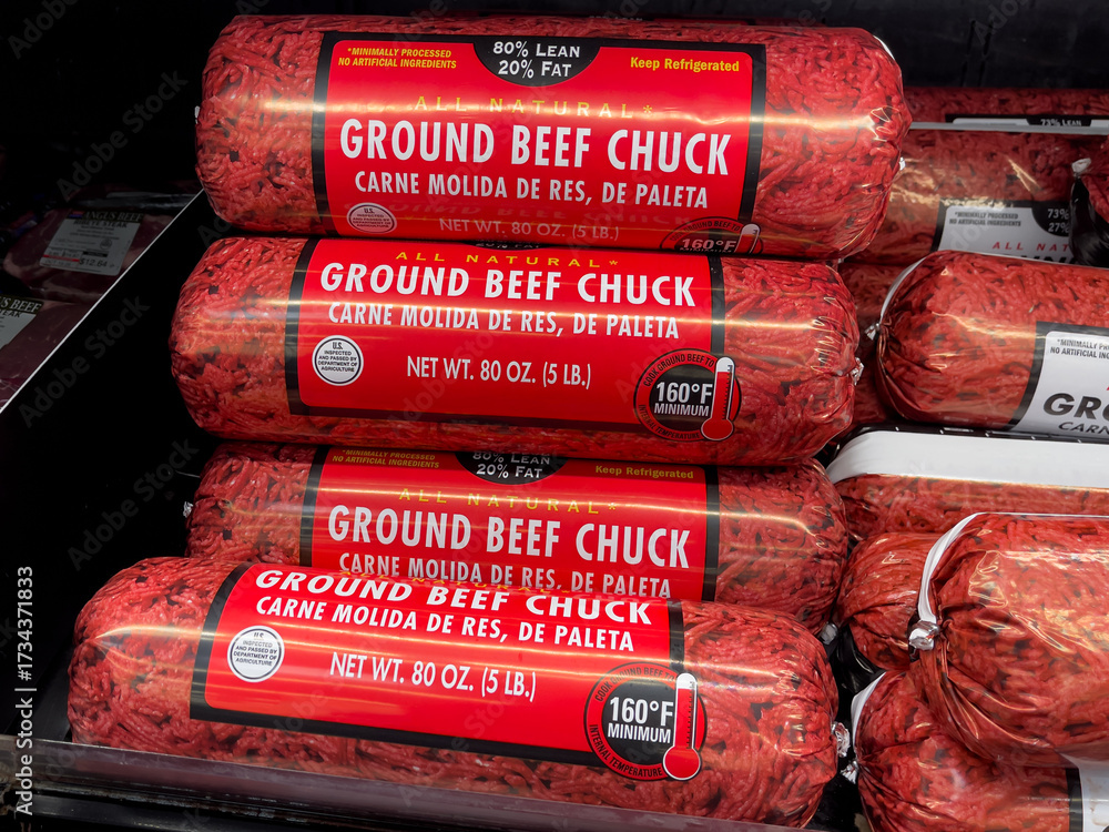 Fresh ground beef chuck hamburger meat tubes on display in an American ...
