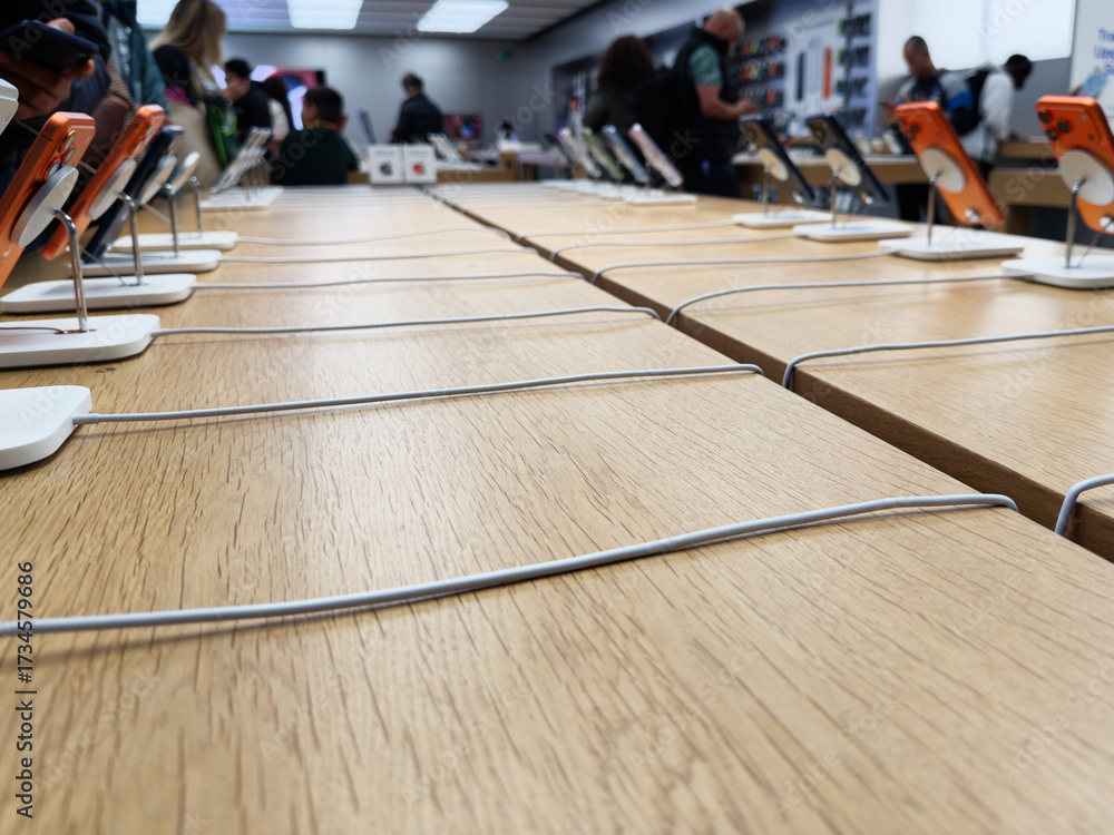 Electronics store showroom with a row of iPhone 17 Pro smartphone ...