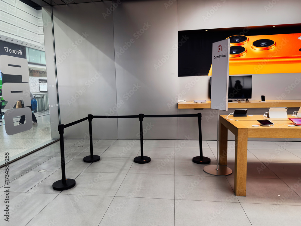 Modern tech Apple showroom with order pickup station, devices on ...