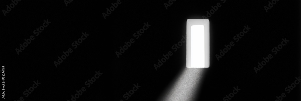 Vertical light slit emitting soft white light on black wall, high ...