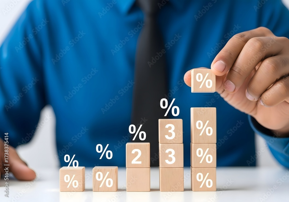 Person stacking wooden blocks with percentage symbols and numbers in a ...