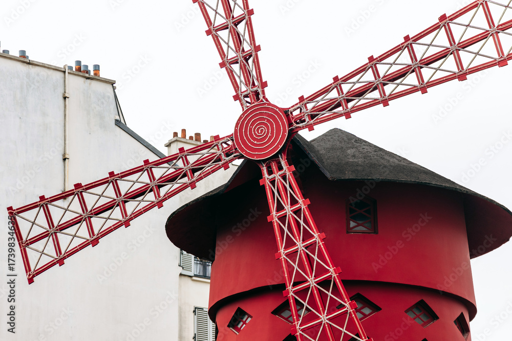 Paris, France - September 11, 2025: The iconic red windmill and ...