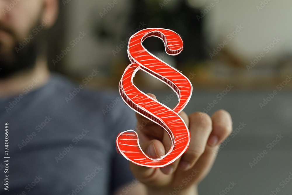 Hand pointing at red paragraph symbol. Legal, law, justice, contract ...