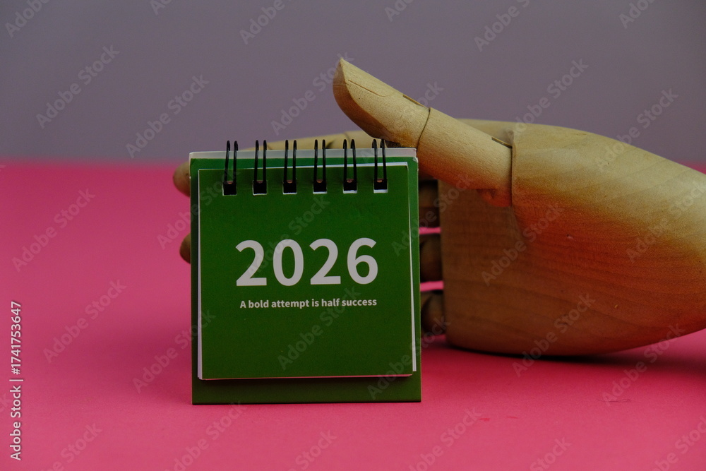 Photo Stock word 2026 on green calendar nearby colorful office tools as ...