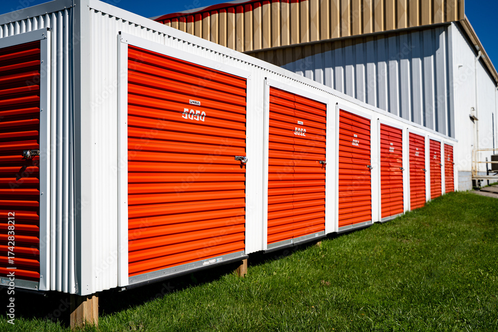 Row of red U-Haul storage unit doors with locks. Toronto, Canada ...