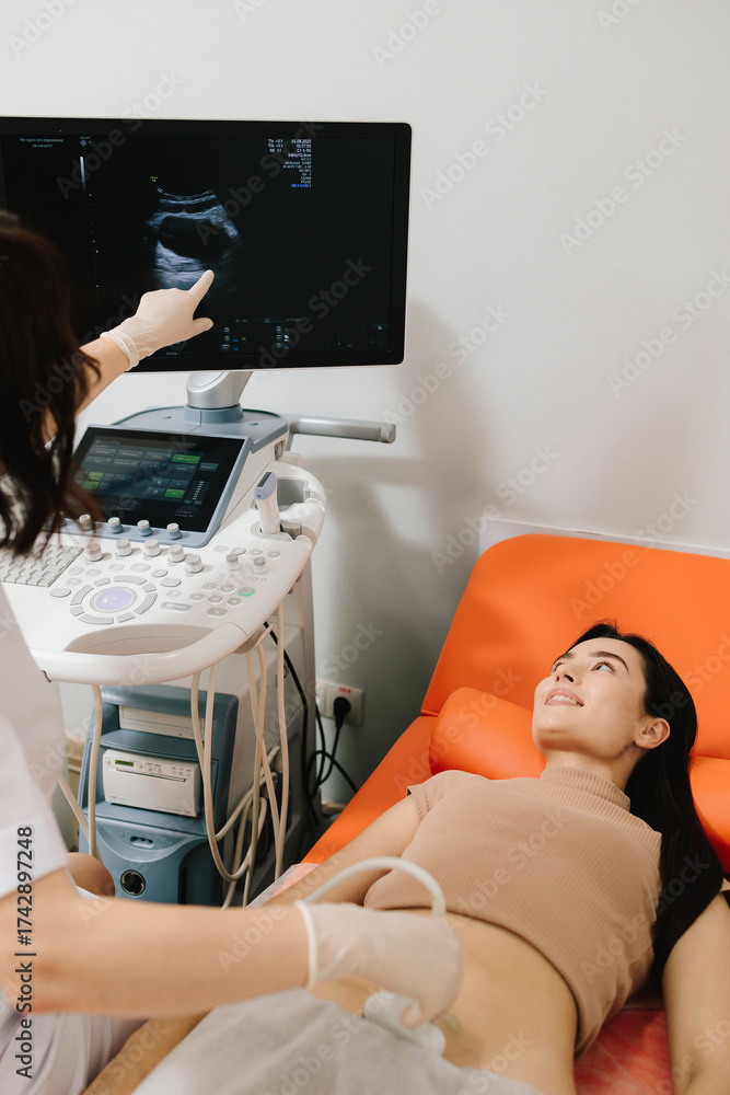 Ultrasound machine shows detailed internal imaging on screen. The ...