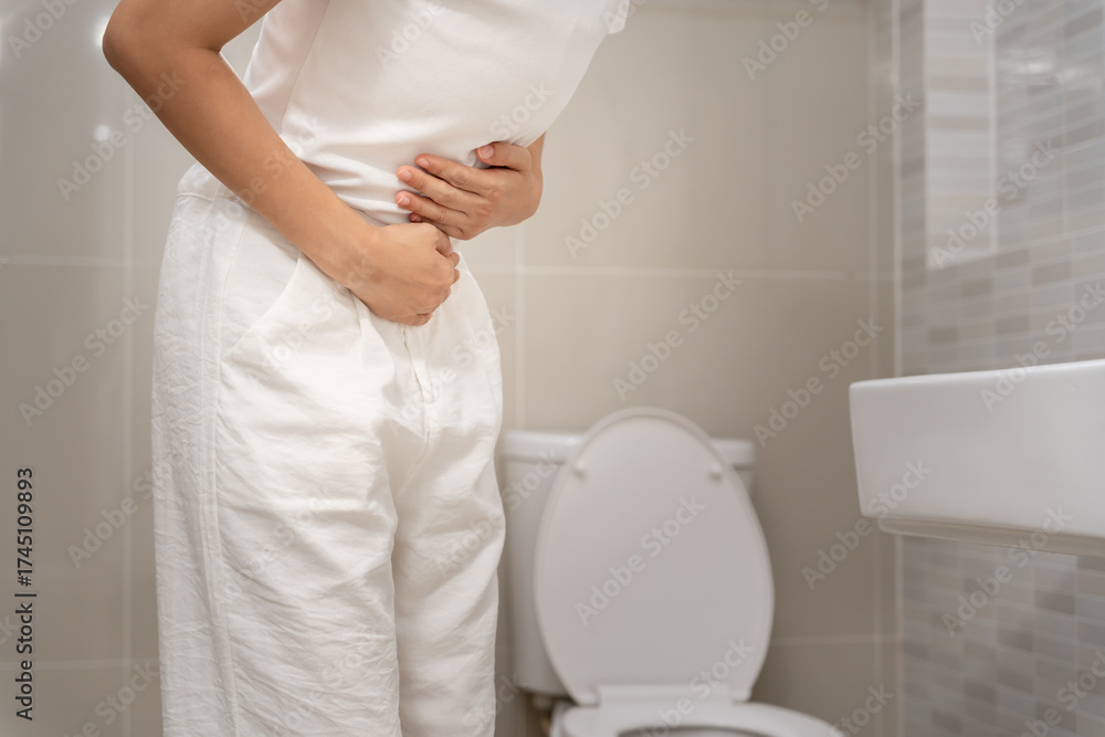Constipation and diarrhea in bathroom. Hurt woman touch belly stomach ...
